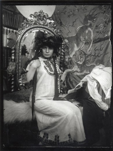Model in a Bohemian folk costume posing in Mucha's studio, Rue du Val ...